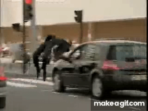 a guy jumps into a car on Make a GIF