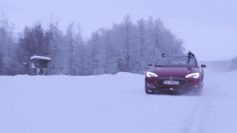 Tesla driving in snowy weather on Make a GIF