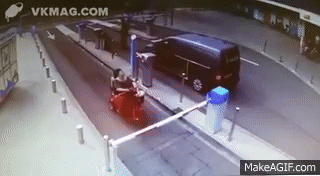 Woman on mobility scooter hitting the boom gate barrier on Make a GIF