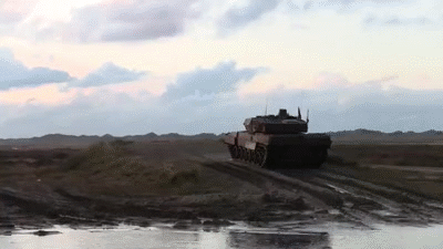 Leopard 2A5DK firing APFSDS-T practice round on Make a GIF
