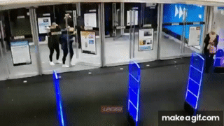 Guy shatters glass doors entering store on Make a GIF