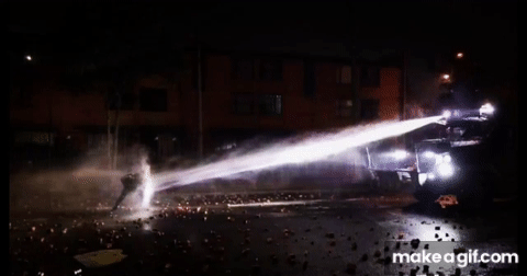 Colombian protestor single-handedly holds back an armored water-cannon ...