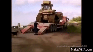 bulldozer slides sideways off truck during unloading dozer accidente ...