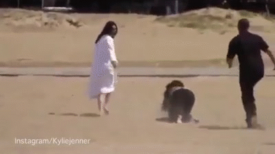 Kylie Jenner takes a tumble on beach run with Kendall! on Make a GIF