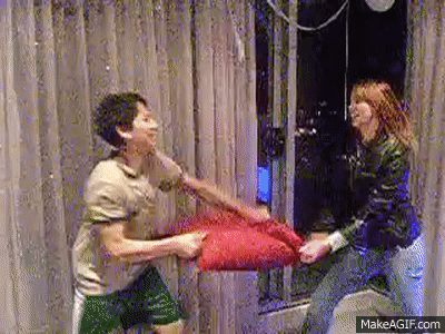 Girl misses first nutshot but owns boy on second attempt on Make a GIF