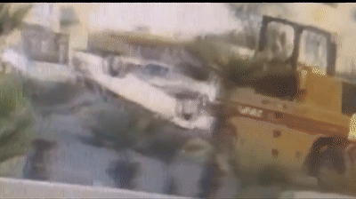 CAUGHT ON CAMERA: Paving equipment plows into car on Make a GIF