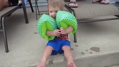 Little Boy With Floaties Tries To Eat Cookie on Make a GIF