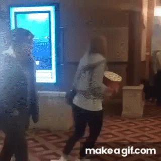Girl Tripping Over in Cinema With Popcorn on Make a GIF