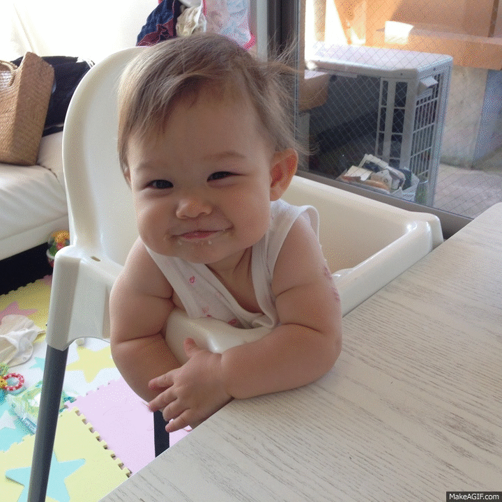 Baby breaking into laughter on Make a GIF
