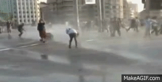 Dude gets washed by fire hose and dose a flip! on Make a GIF